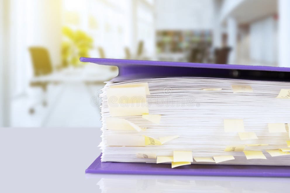 Stack of Reporting Paper Documents in a Purple Folder with Bookmarks on ...