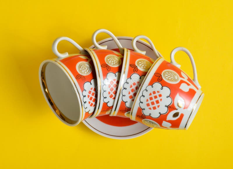 Stack of Retro Cups on a Yellow Background Stock Photo - Image of ...