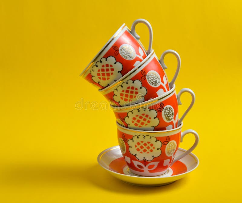 Stack of Retro Cups on a Yellow Background Stock Image - Image of ...