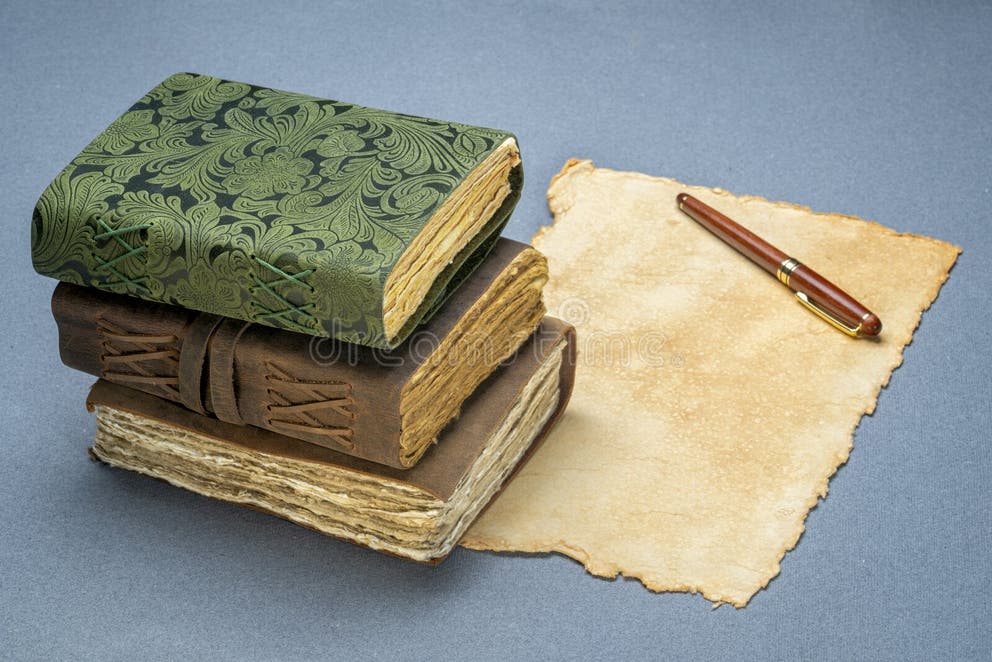 Stack of Retro Journals with a Blank Sheet of Handmade Paper Stock ...