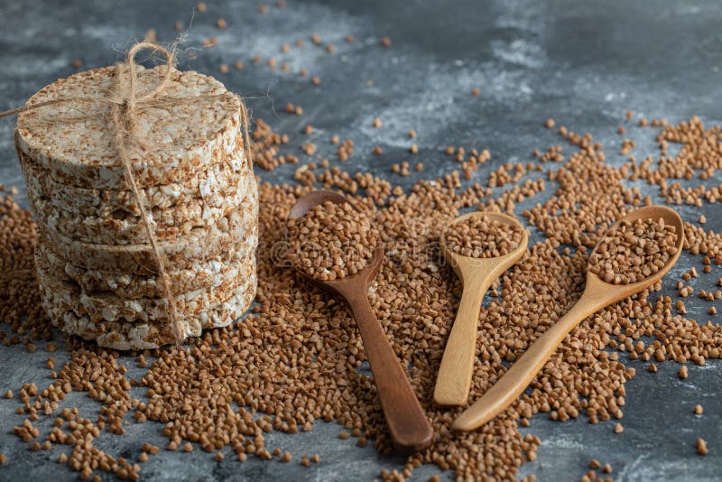 Stack of Rice Cakes and Uncooked Buckwheat on Marble Surface Stock ...