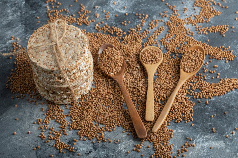 Stack of Rice Cakes and Uncooked Buckwheat on Marble Surface Stock ...