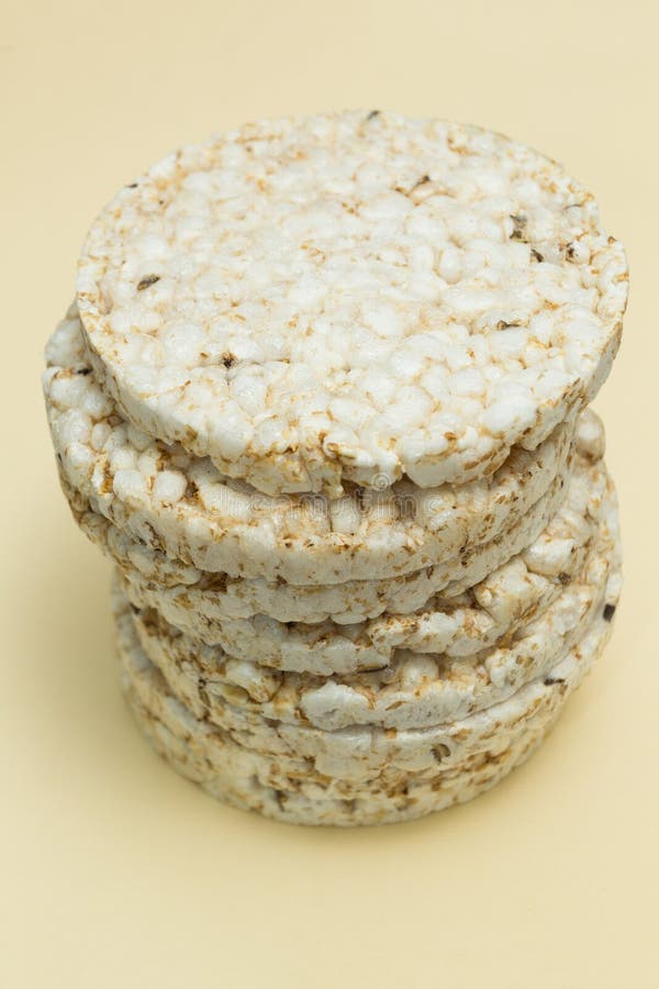 A Stack of Rice Loaves on a Brown Background Stock Image - Image of ...