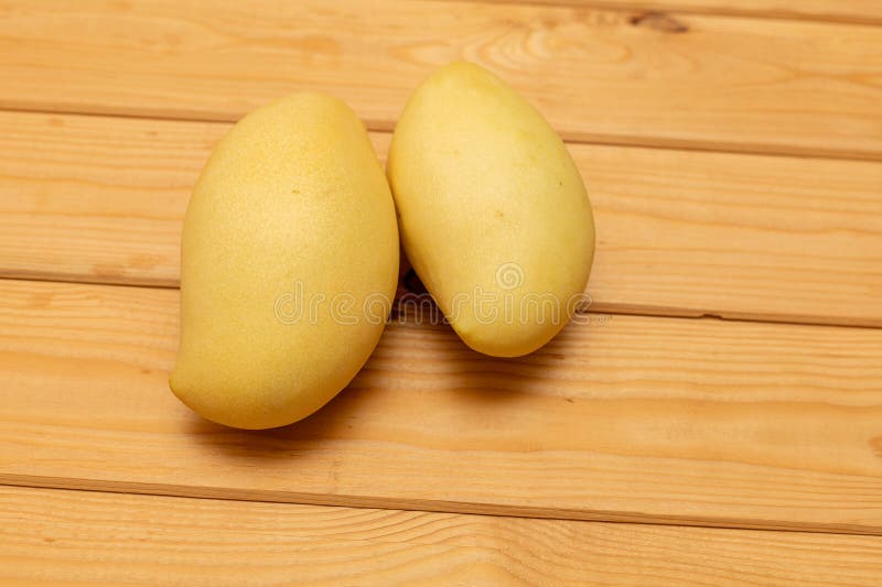 Stack of Ripe Mangoes Fruit on Wooden Table with Green Nature at Farm ...