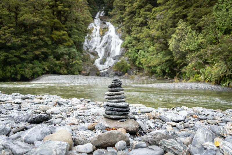 Stack of Rocks, Cairn, Positioned on a Pebble Beach in Front of Big ...