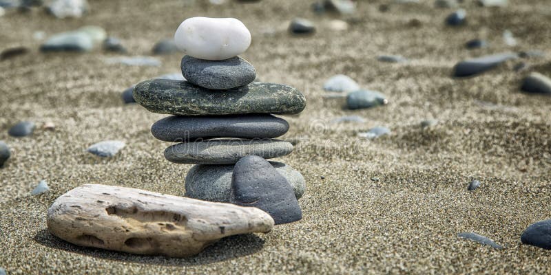 Stack of Rocks on a Sandy Beach Stock Image - Image of horizontal ...