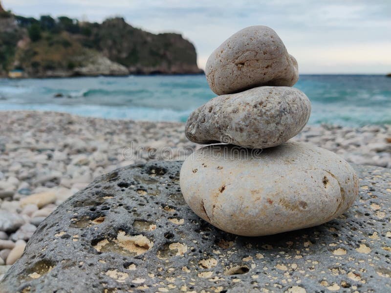 Stack of Rocks on Stony Beach in Taormina. View with Sea Water and Sky ...