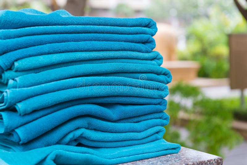 Stack Roll of Bath Blue Towels on Table at Swimming Pool Stock Image ...