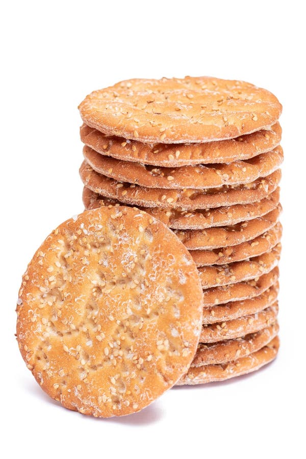 A Stack of Round Salt Crackers with Sesame on White Background Stock ...
