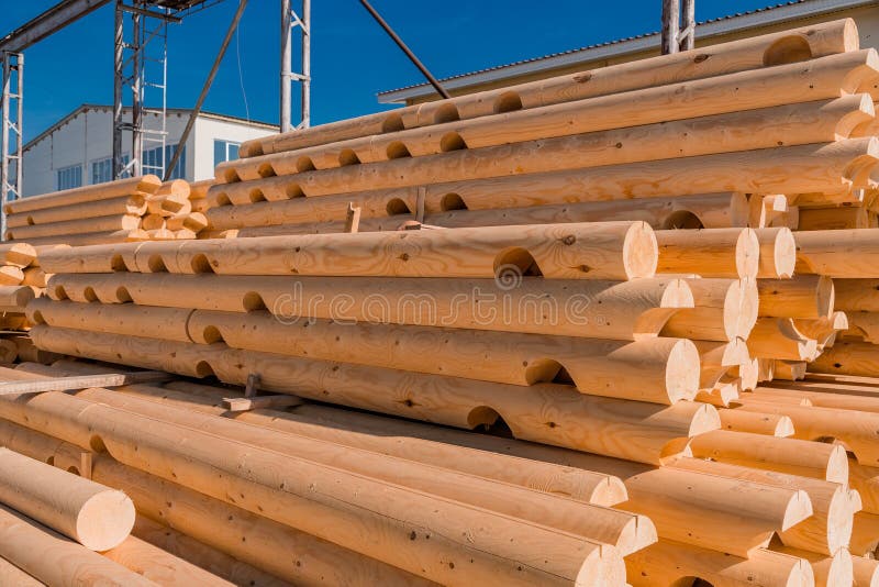 Stack of Round Timber Logs for Building Wooden House. Removing Bark ...