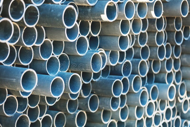 Stack of Rounded Steel Pipes Stock Image - Image of parallel, pollute ...
