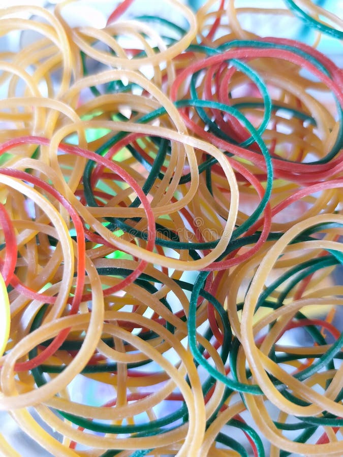 A Stack of Rubber Bands in Hand Stock Photo - Image of stack, hand ...