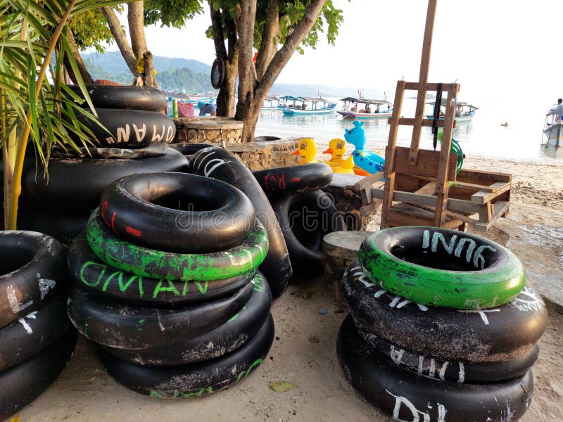 Stack of Rubber Tires from a Beach Stock Photo - Image of pumped ...