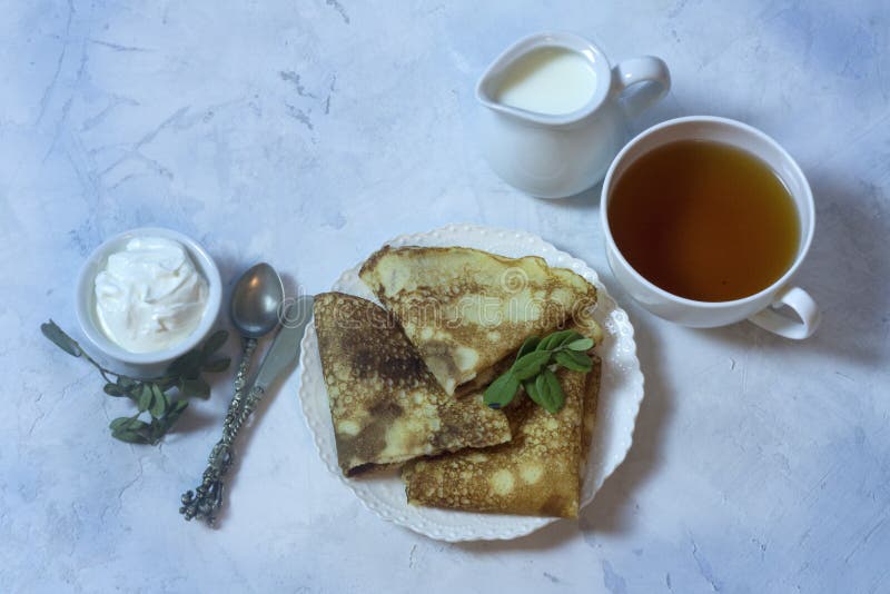 Stack of Russian Thin Pancakes Blini with Fresh Sour Cream and Tea ...