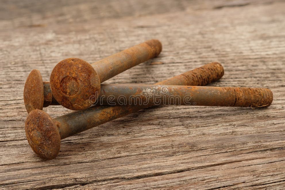 Stack Rusty Metal Screws on Rustic Wood Stock Photo - Image of ...