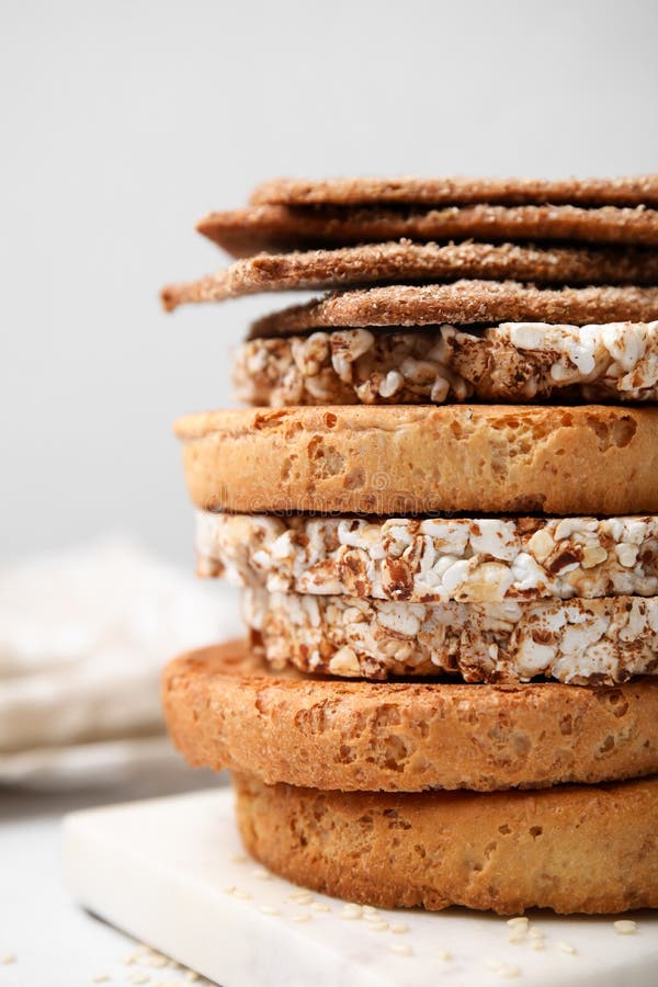 Stack of Rye Crispbreads, Rice Cakes and Rusks on Table, Closeup Stock ...