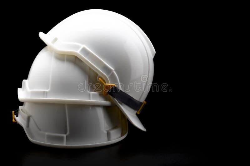 Stack of Safety Helmets on Black Background , Plastic White ...