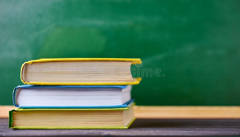 Stack of School Books Against Green Chalkboard. Reading and Education ...