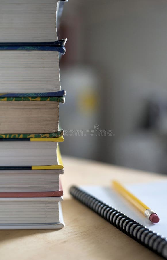 Stack of Books with Homework Sucks Written in Notebook Stock Image ...