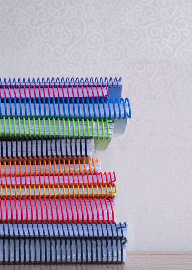 Stack of School Colorful Spiral Notebooks, Reports and Documents on ...