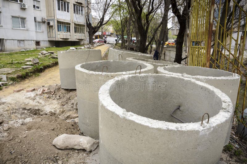 Stack of Sewer Concrete Pipes in a Construction Site. Stock Photo ...