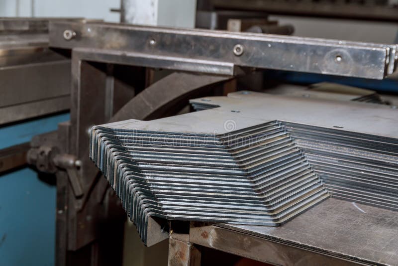 Metal Products Bent on a Bending Machine. Work in the Metalworking Shop ...