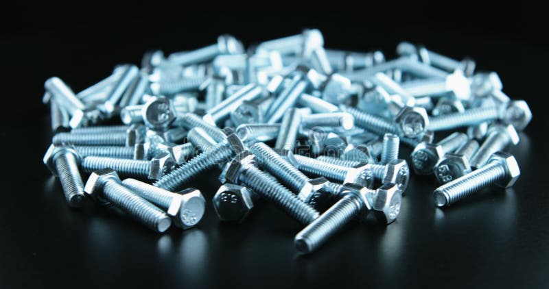 Stack of Shiny Screw, Bolt or Stud Rotating on a White Background ...