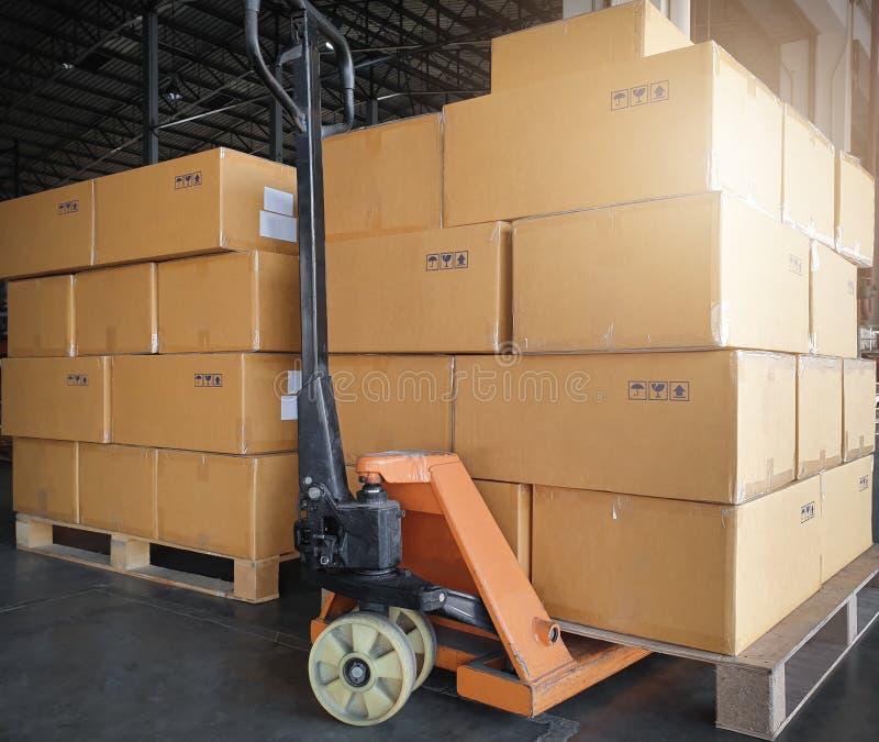 Stack of Shipments Boxes on Pallet Waiting for Load into a Truck. Road ...