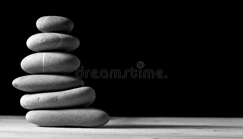 Stack of Six Smooth Gray Stones in Balance Over Black Background Stock ...