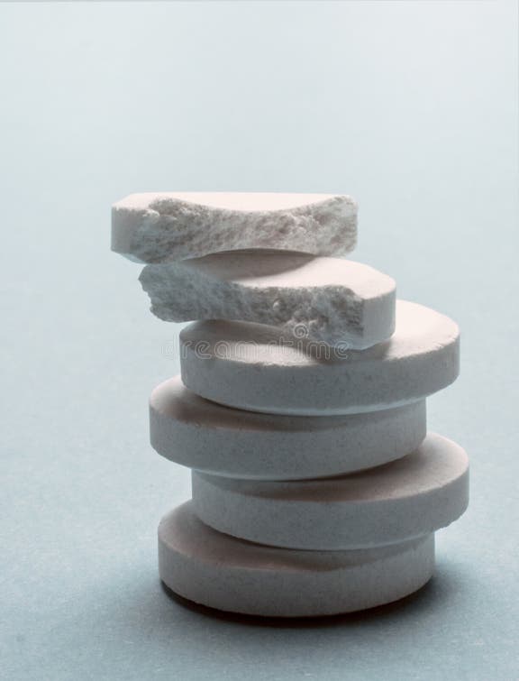 A Stack of Six White Tablets, Top Two Broken in Half Stock Image ...