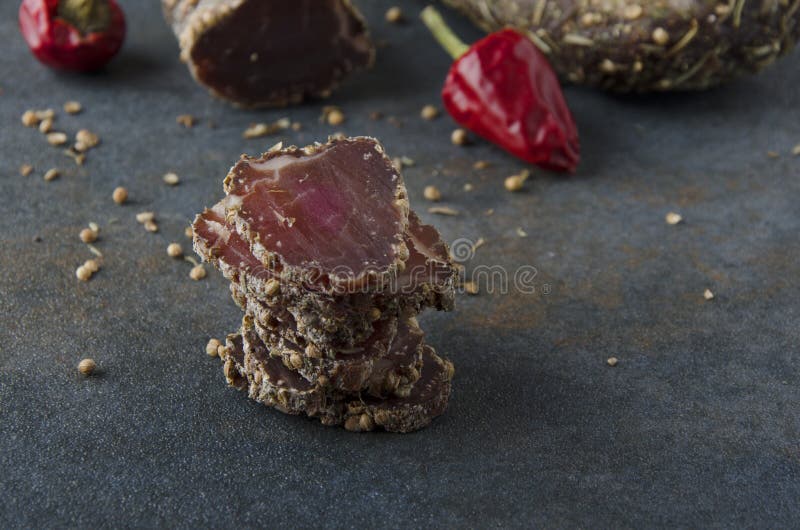 Stack of Slices Dried Meat with Spices on Grey Table Stock Image ...