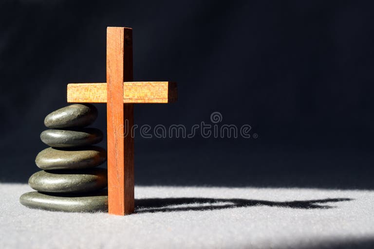 Stack of Smooth Stones with a Simple Wooden Cross Stock Image - Image ...