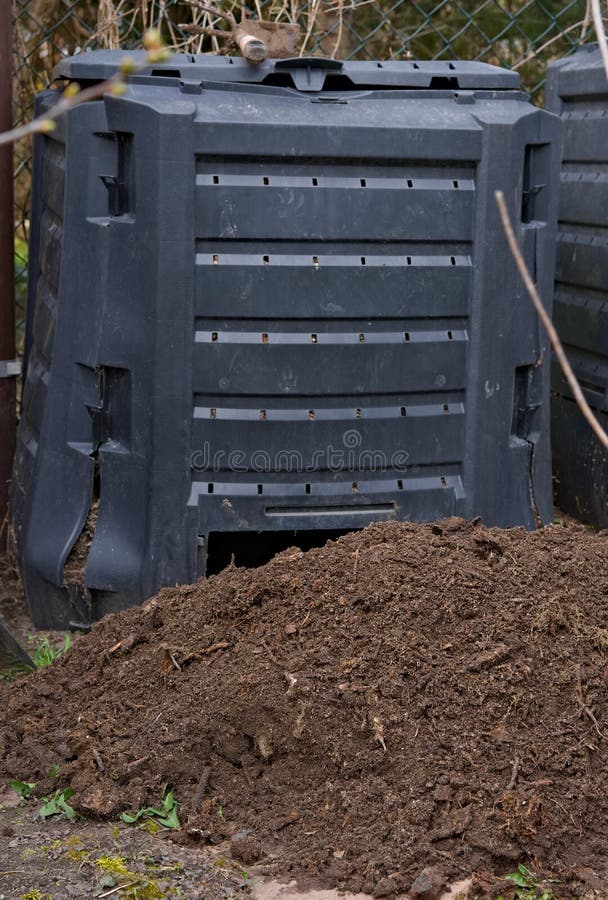 A Stack of Soil in Front of the Composter Stock Photo - Image of ...