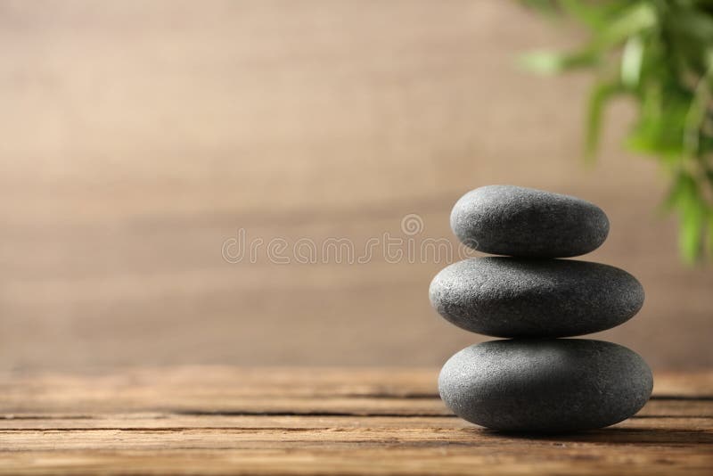 Stack of Spa Stones on Wooden Table. Space for Text Stock Photo - Image ...