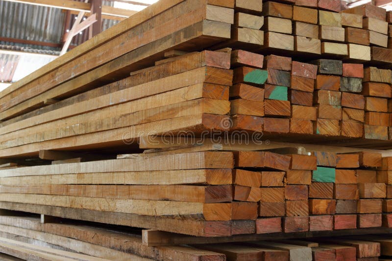 Stack of Square Wood Planks for Construction in Warehouse Stock Image ...