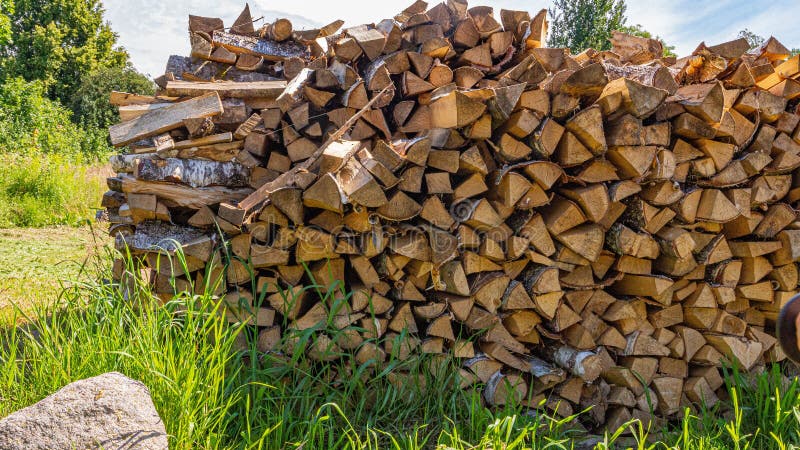 Stack of Stacked Firewood on a Summer Blue Sky Background Stock Image ...