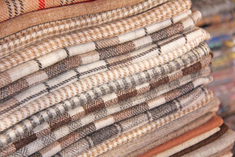 A Stack of Stoles of Cashmere Wool is Brown and Beige in a Cage Stock ...