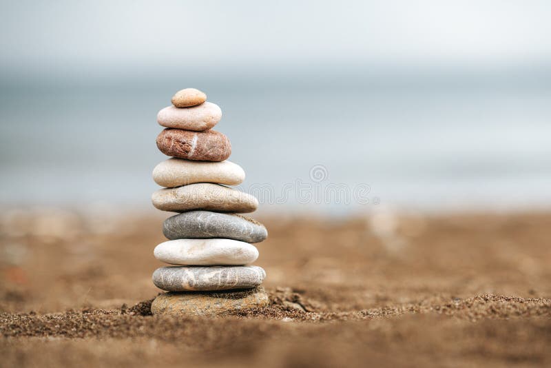 Stack of Stone Over the Sand. Balance and Stability Concept with Stones ...