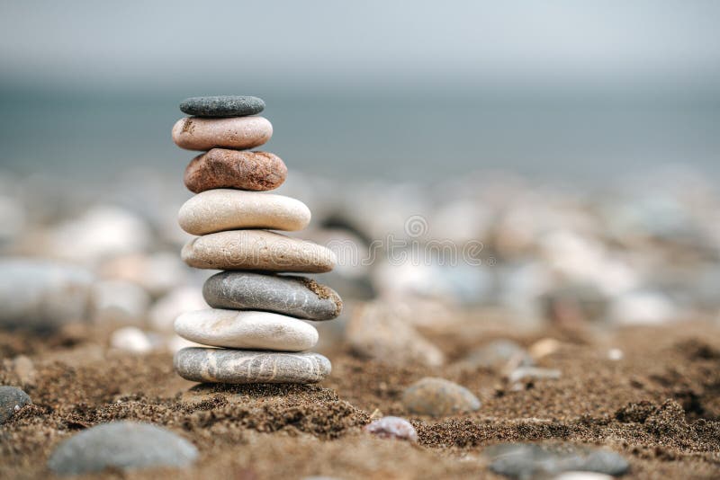 Stack of Stone Over the Sand. Balance and Stability Concept with Stones ...