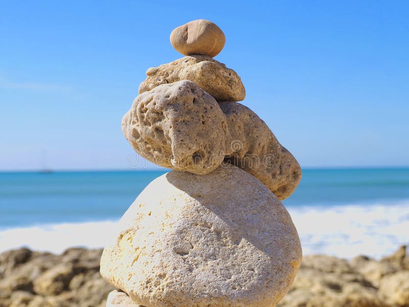 Stacks of Stones in Front of Blue Ocean Stock Image - Image of pebble ...