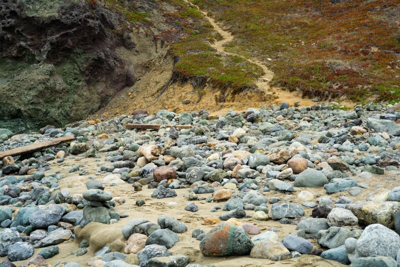 Stack of stones at beach stock photo. Image of coast - 131609028