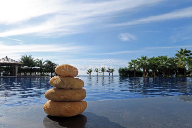 Stack of Stones on Pool Edge Stock Photo - Image of arecales, pool ...