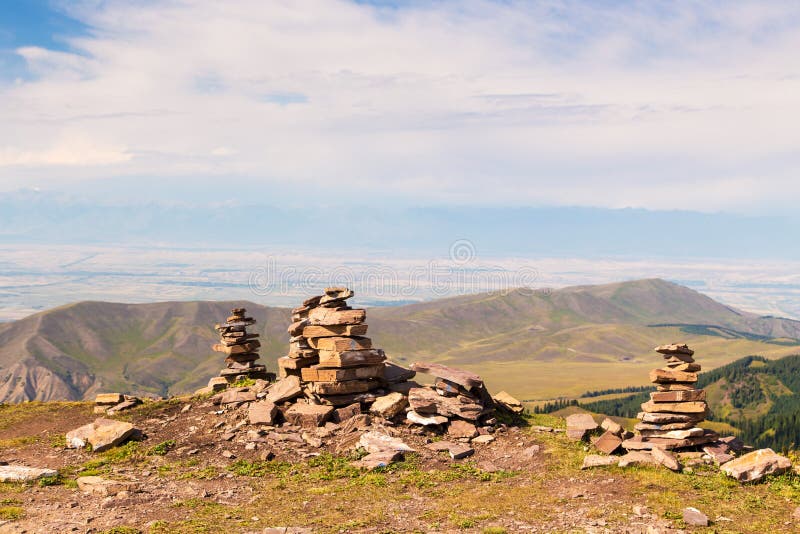 Stack of Stones Rocks Trail Marker Cairn in the Mountains. Against the ...