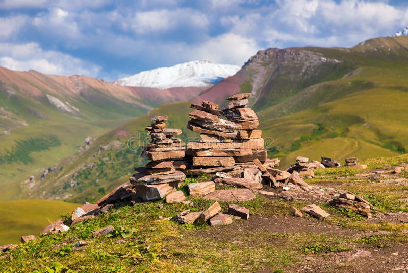Stack of Stones Rocks Trail Marker Cairn in the Mountains. Against the ...
