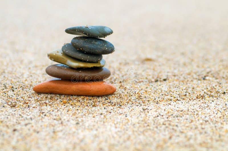 Stack of Beach Stones on Sand Stock Photo - Image of outdoors ...