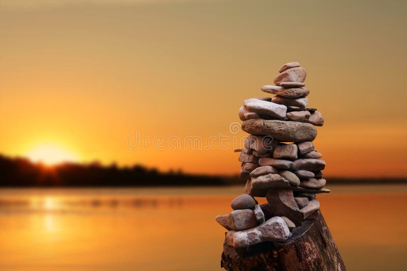 Stack of Stones on Tree Stump in Forest. Stock Photo - Image of calm ...
