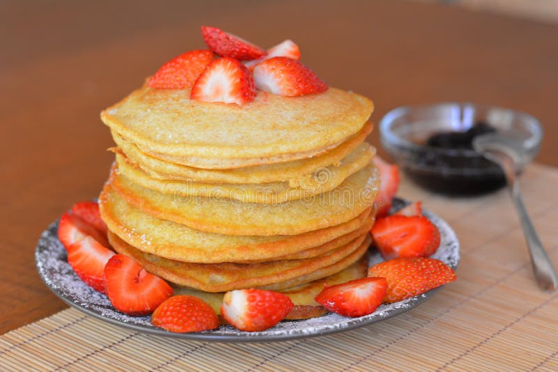 Stack of Sweet Pancakes with Fresh Strawberries and Icing Sugar Stock ...