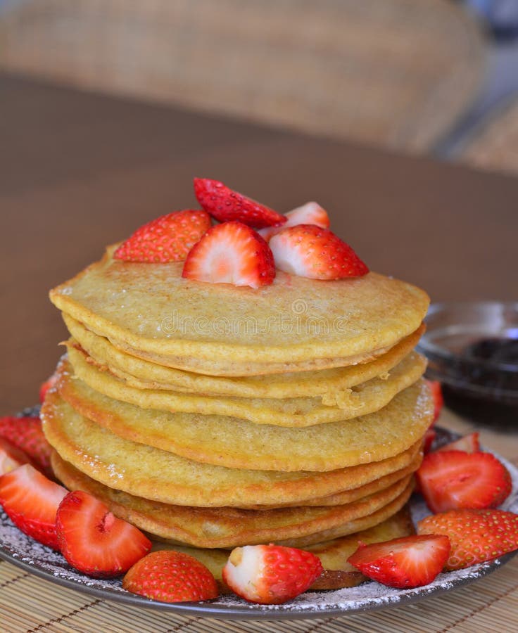 Stack of Sweet Pancakes with Fresh Strawberries and Icing Sugar Stock ...