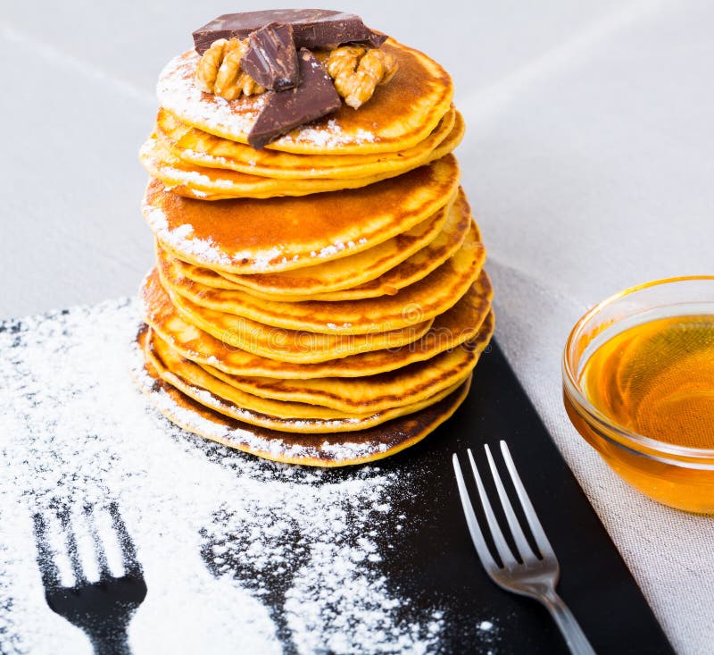 Stack of Sweet Pancakes with with Honey, Chocolate and Powdered Sugar ...