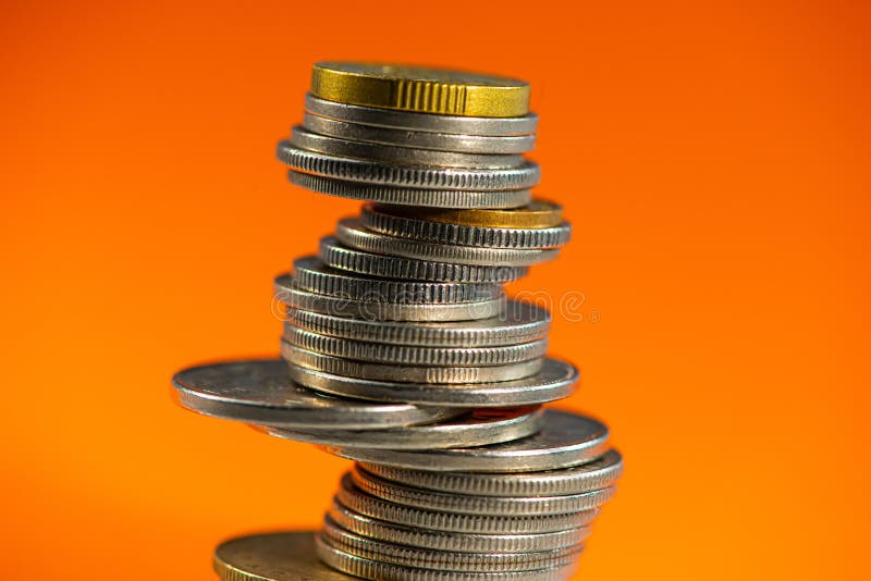 Stack of Swiss Coins on an Orange Background Stock Photo - Image of ...
